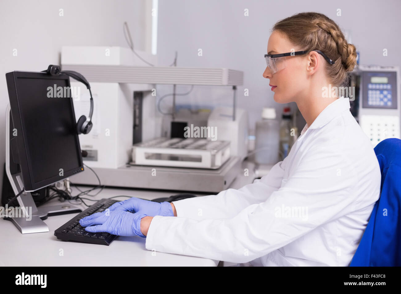 Concentrated scientist working with computer Stock Photo - Alamy