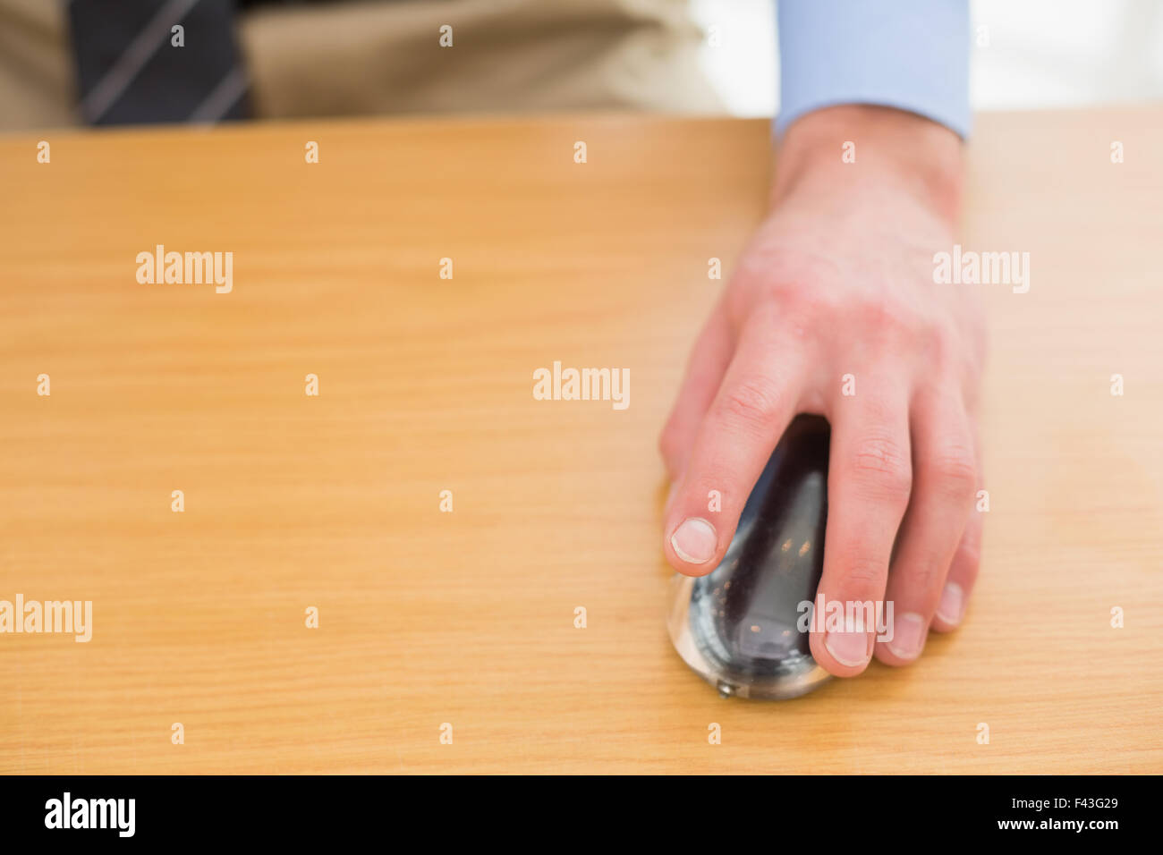 Businessman using mouse of computer Stock Photo - Alamy