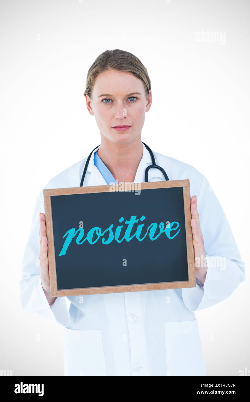 Positive against doctor showing chalkboard Stock Photo - Alamy