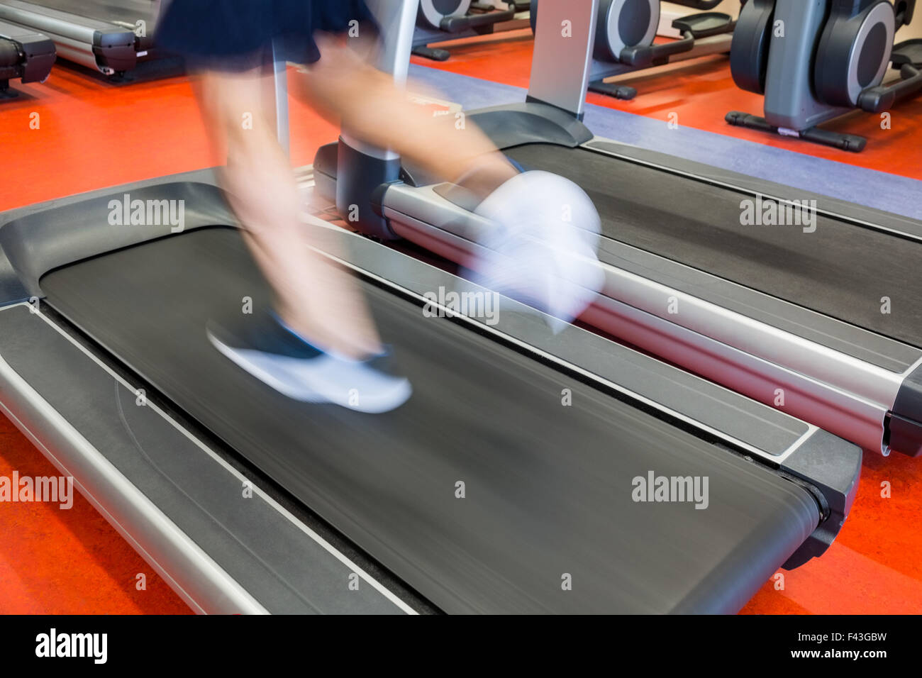 Man running on a treadmill Stock Photo - Alamy