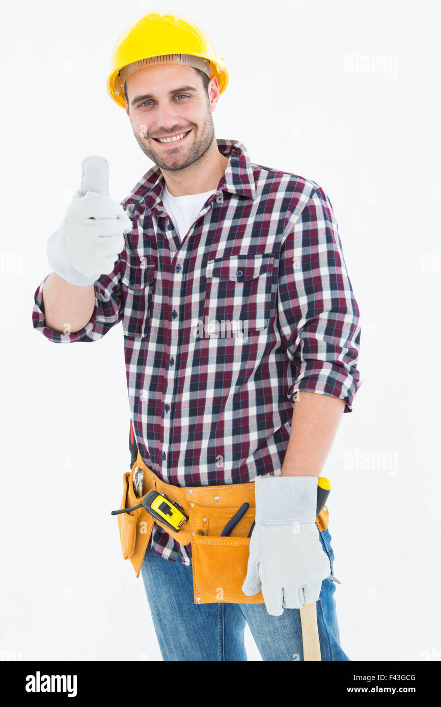 Happy male repairman gesturing thumbs up Stock Photo - Alamy