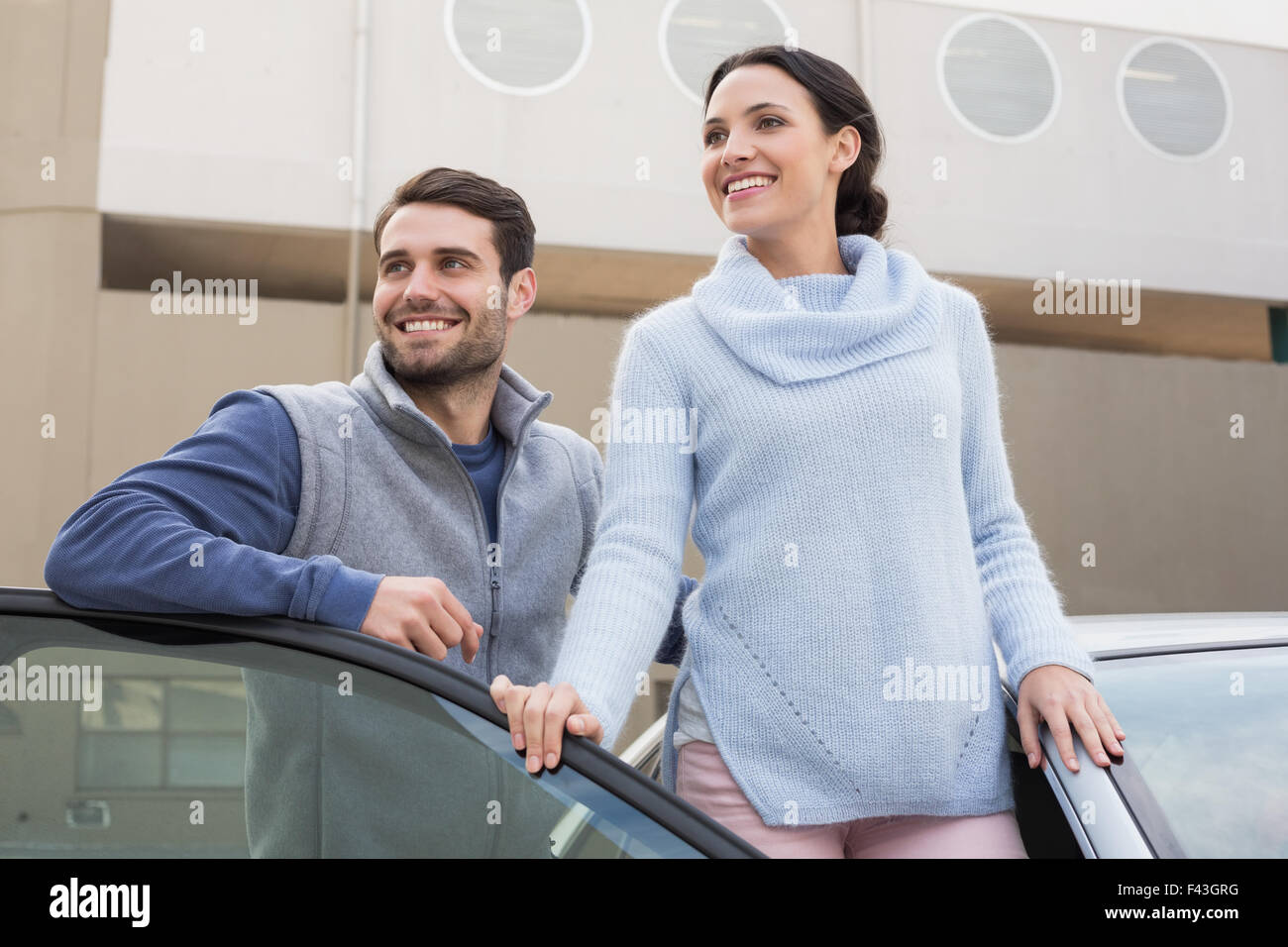 Young couple smiling together Stock Photo - Alamy