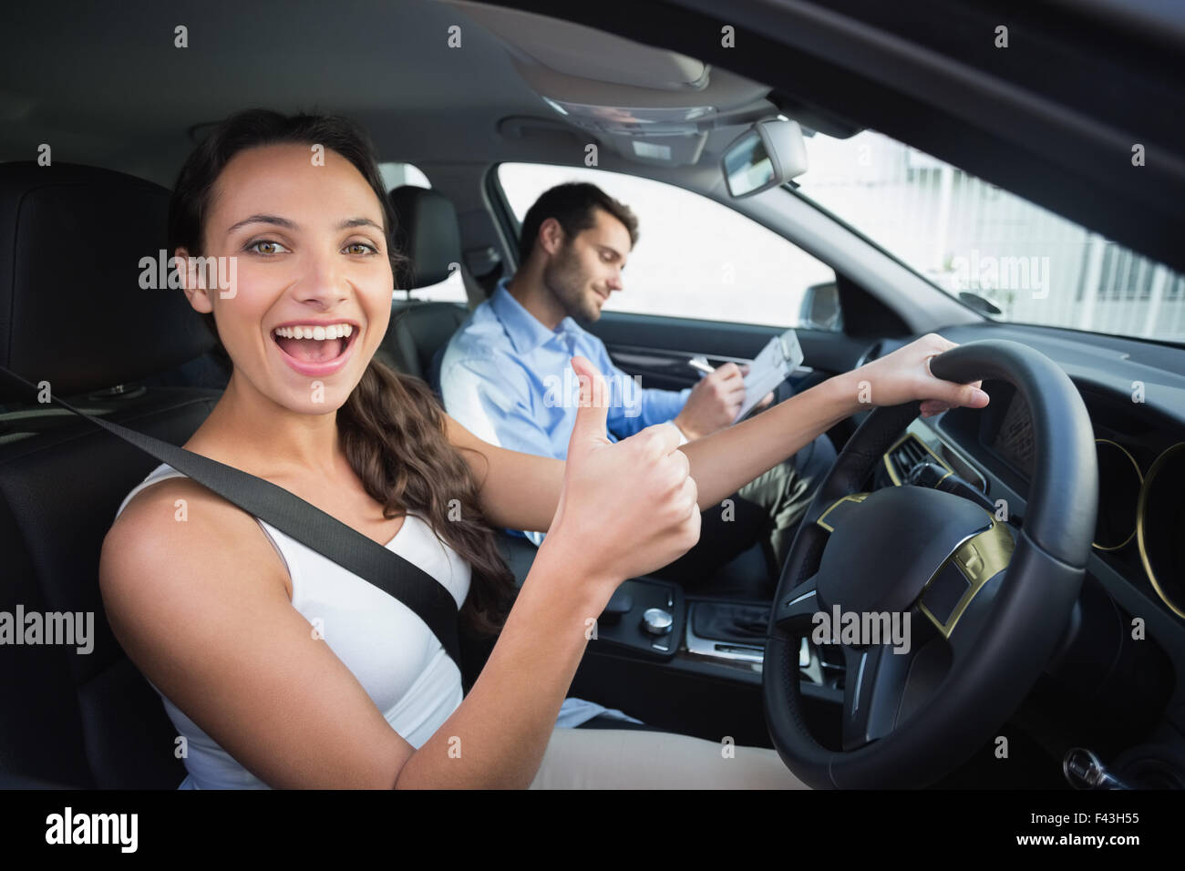 Young woman getting a driving lesson Stock Photo - Alamy