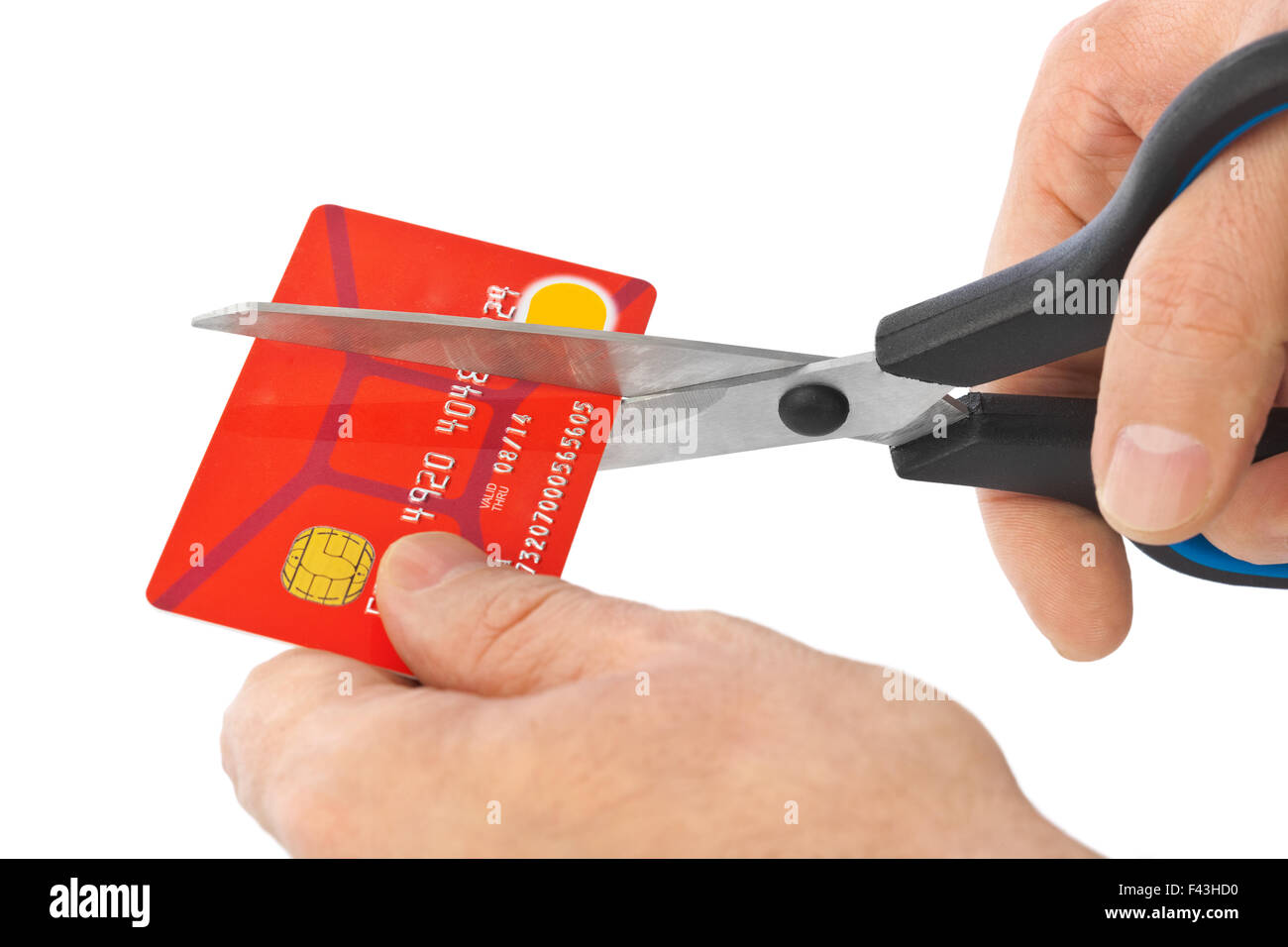 Scissors cutting old credit card Stock Photo - Alamy