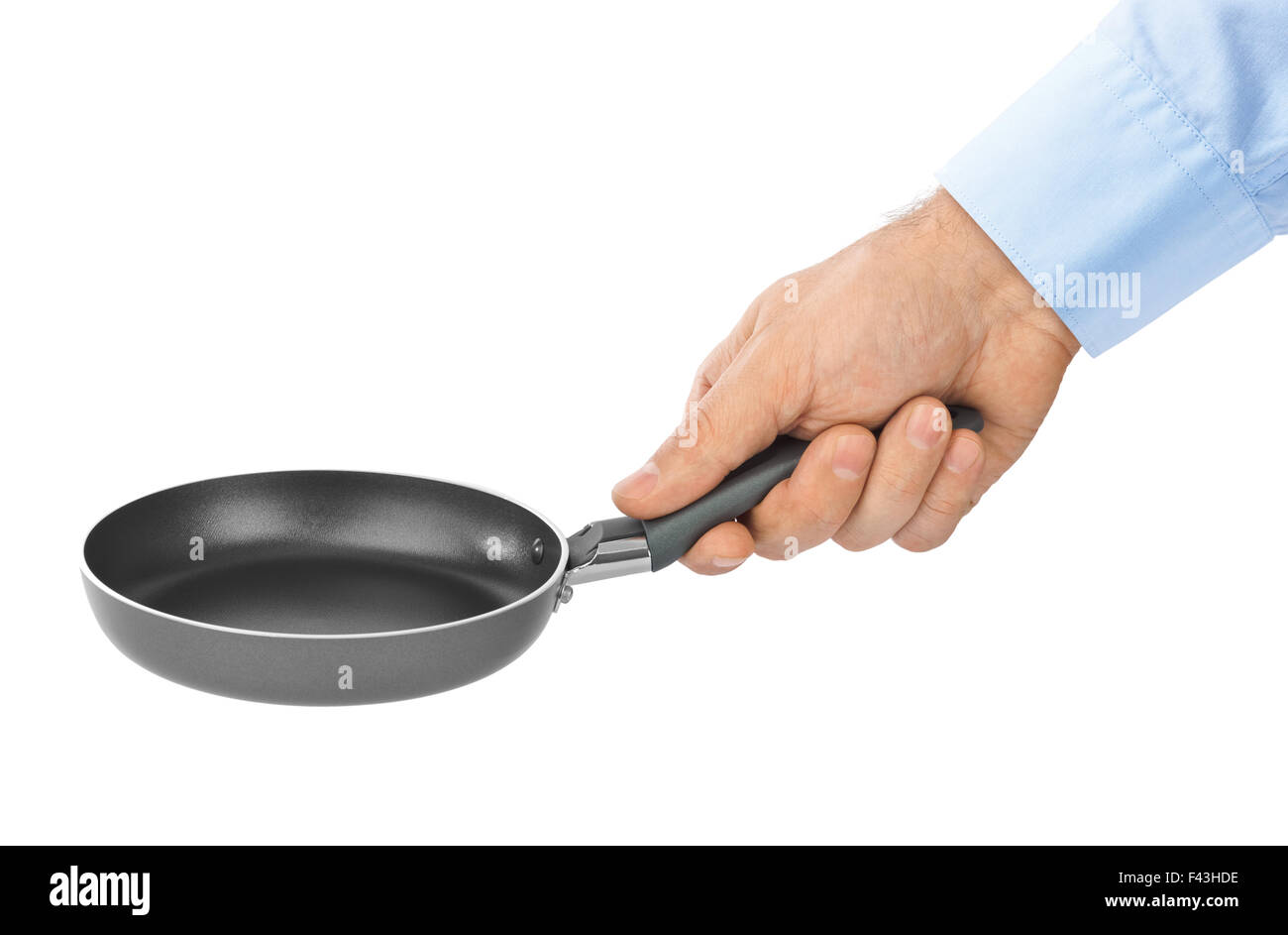 Hand with frying pan Stock Photo - Alamy