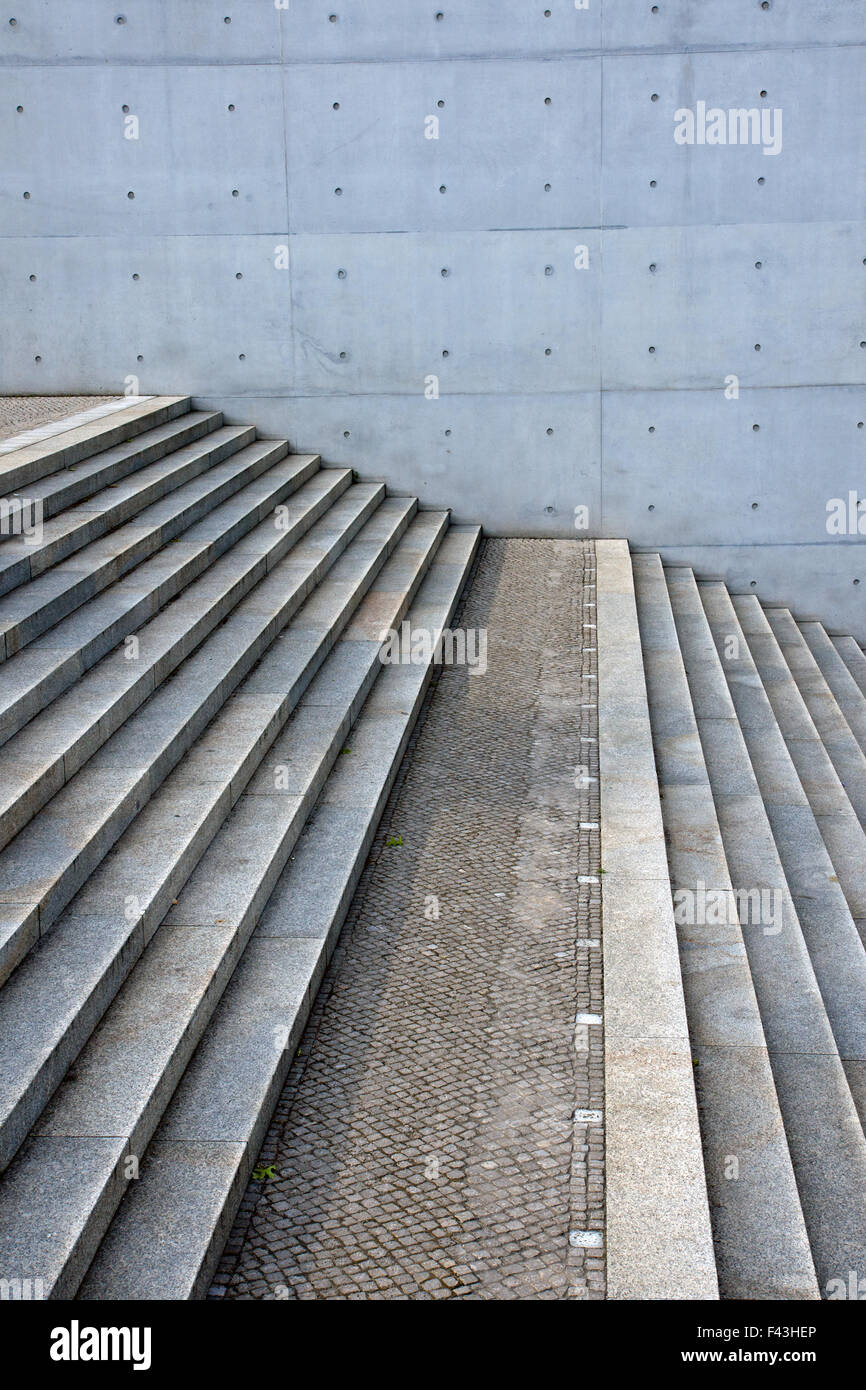Grey barren stairs in front of a concrete wall Stock Photo - Alamy