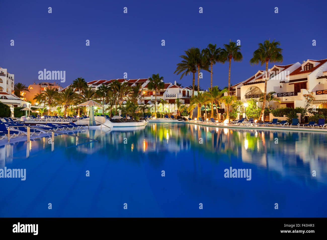 Swimming pool at night Stock Photo - Alamy