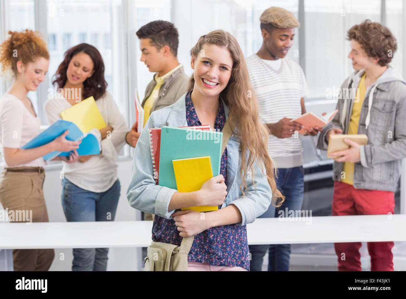 Fashion student smiling at camera Stock Photo - Alamy