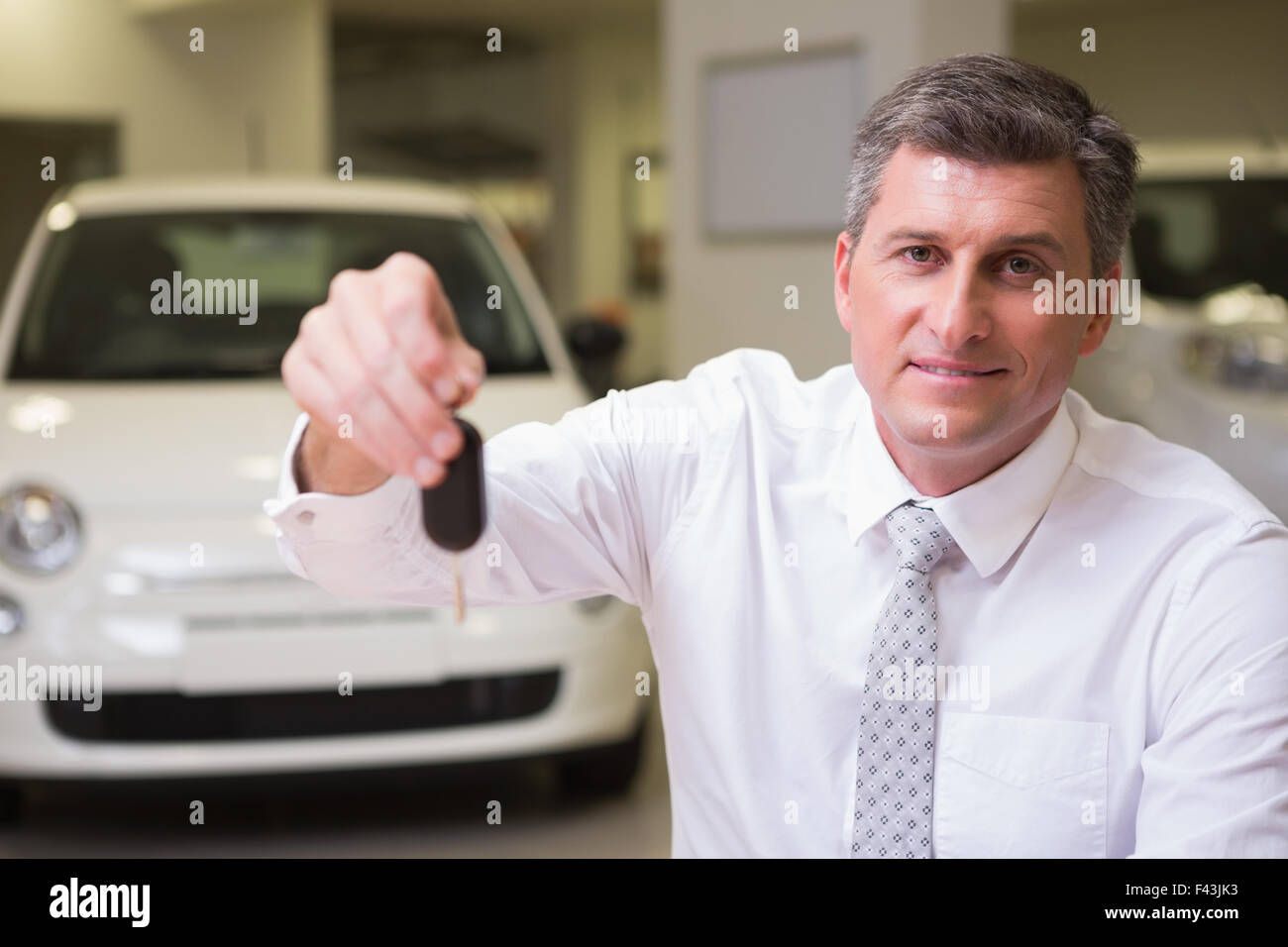 Cheerful salesman car keys hi-res stock photography and images - Alamy