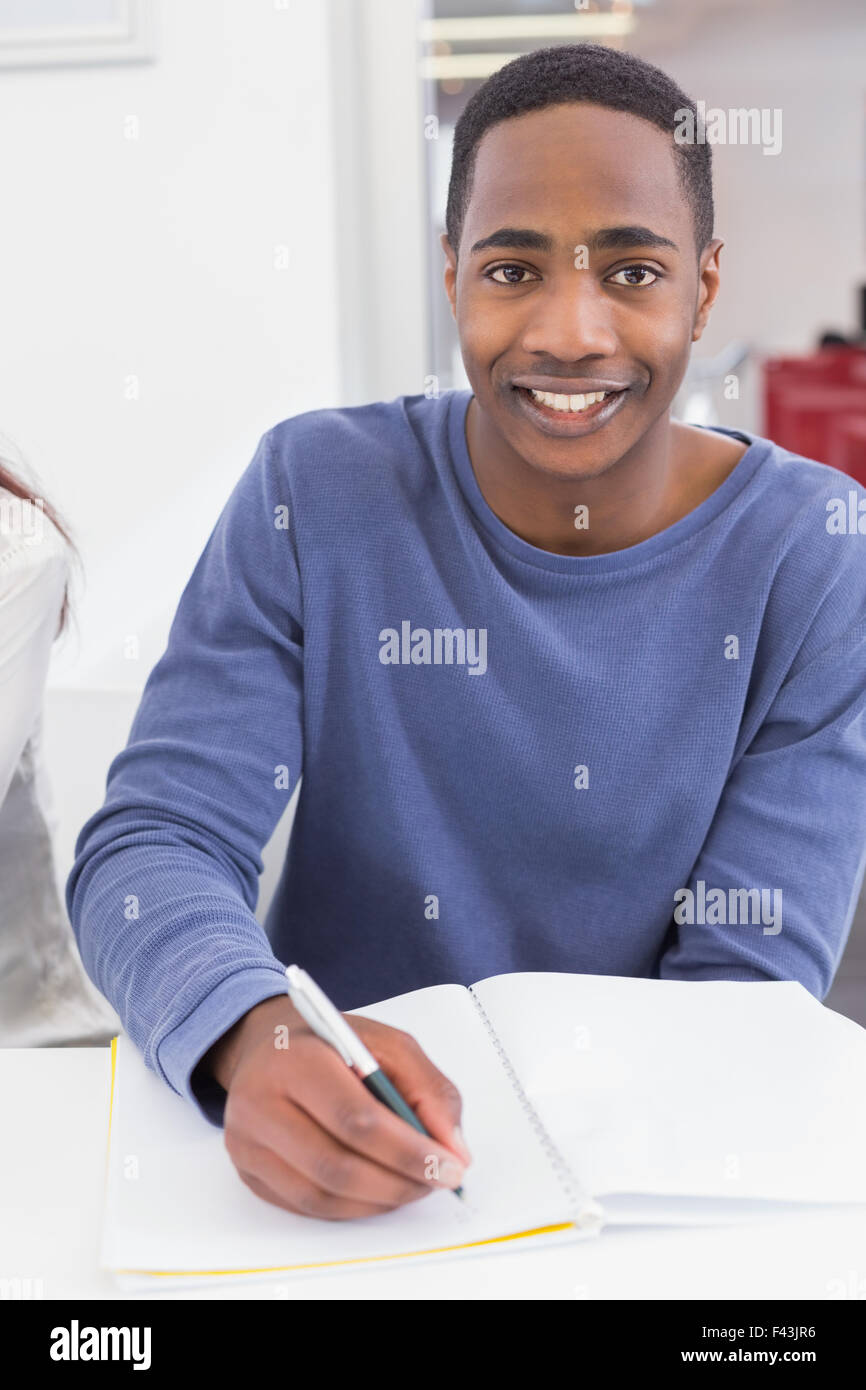Student taking notes in class Stock Photo - Alamy