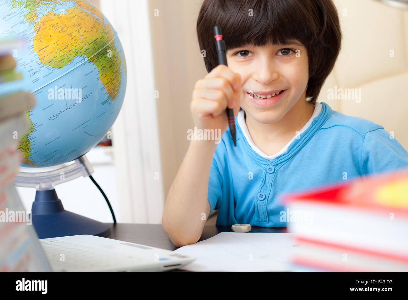 schoolboy doing homework Stock Photo - Alamy