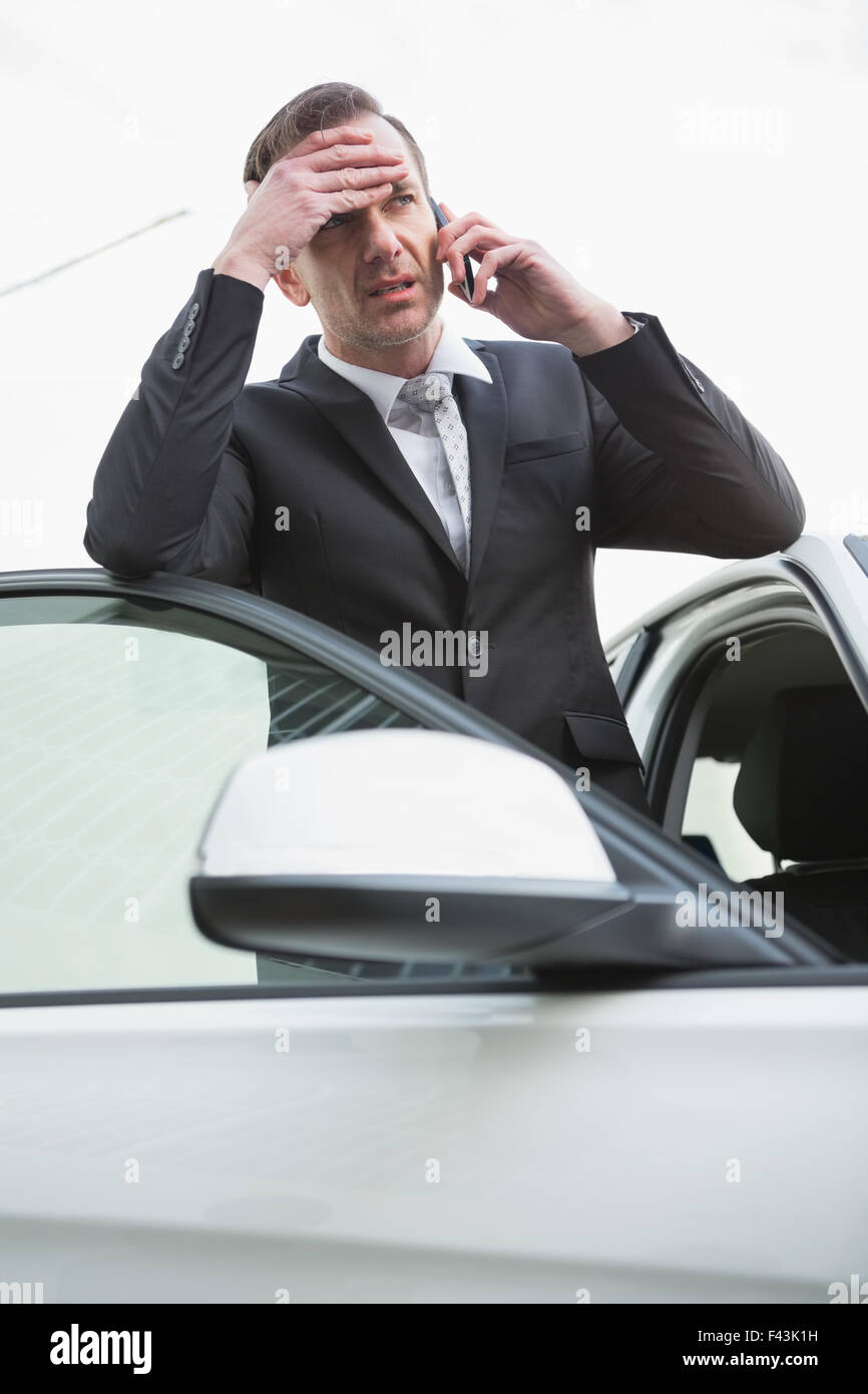 Nervous businessman on the phone Stock Photo - Alamy