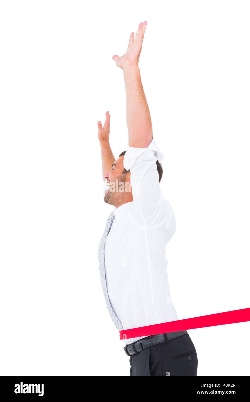 Businessman crossing the finish line Stock Photo - Alamy