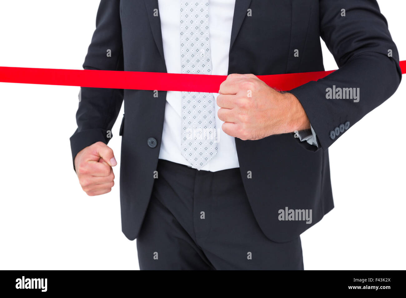 Businessman crossing the finish line Stock Photo - Alamy