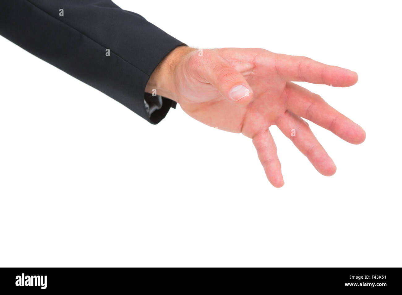 Businessman holding hand out Stock Photo - Alamy