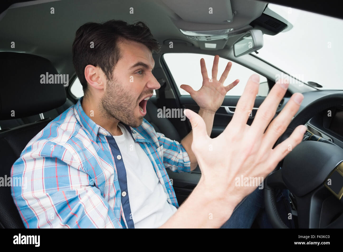 Young man experiencing road rage Stock Photo - Alamy