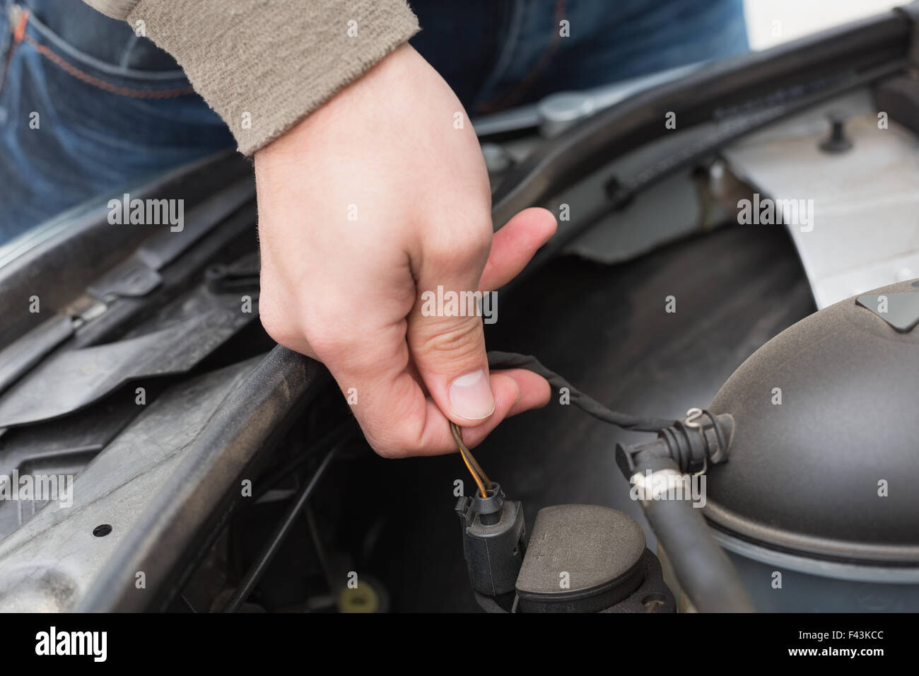 Man checking the engine of his car Stock Photo - Alamy