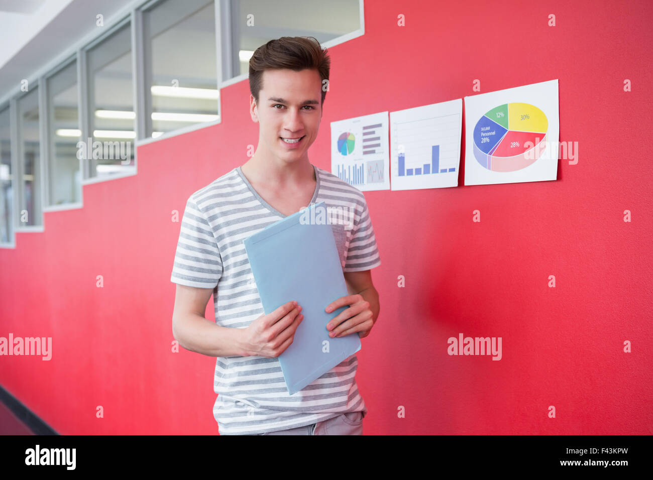 Cheerful student holding notebook hi-res stock photography and images ...