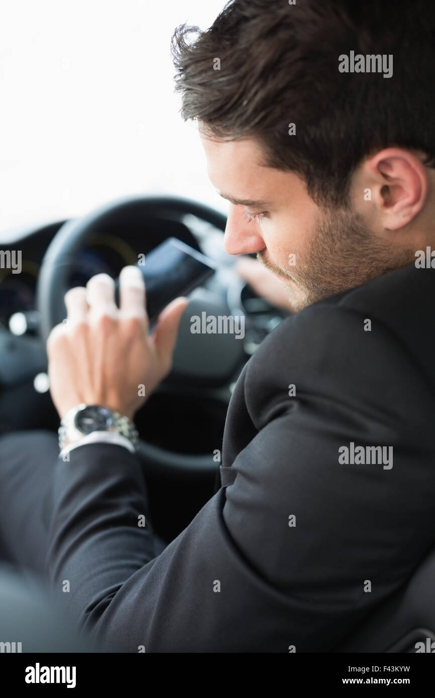 Young businessman checking his watch Stock Photo - Alamy