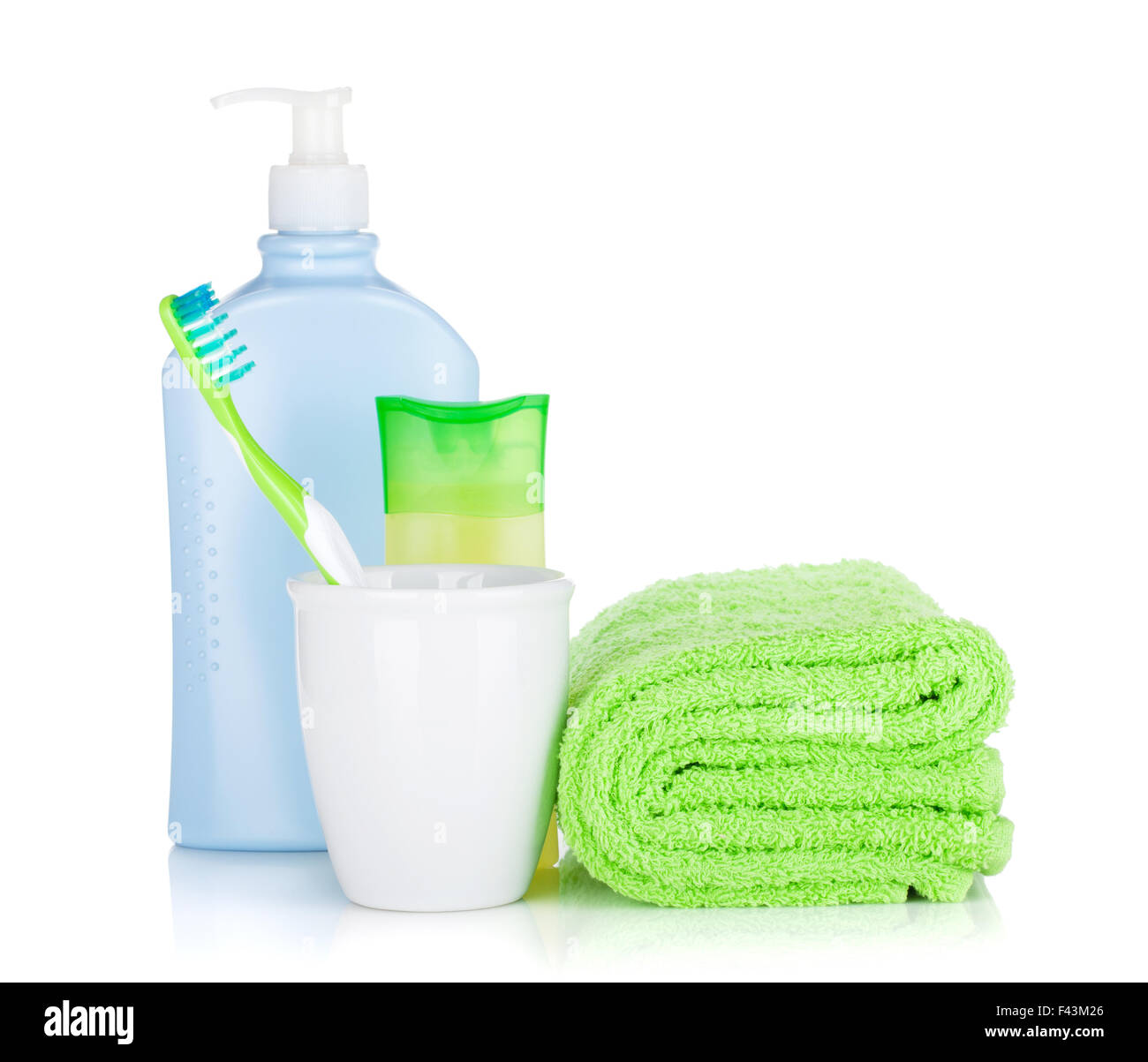 Toothbrush, cosmetics bottles and towel. Isolated on white background ...