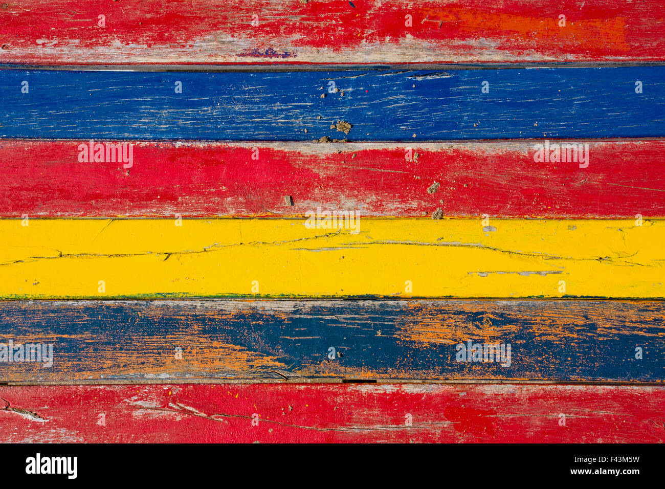 Worn screen of boards in red, blue and yellow Stock Photo - Alamy