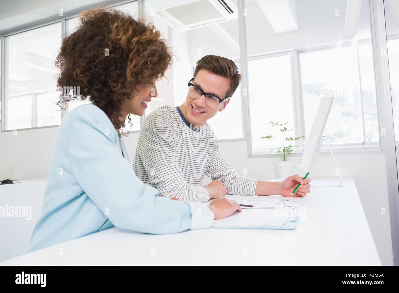 Students working together in class Stock Photo - Alamy