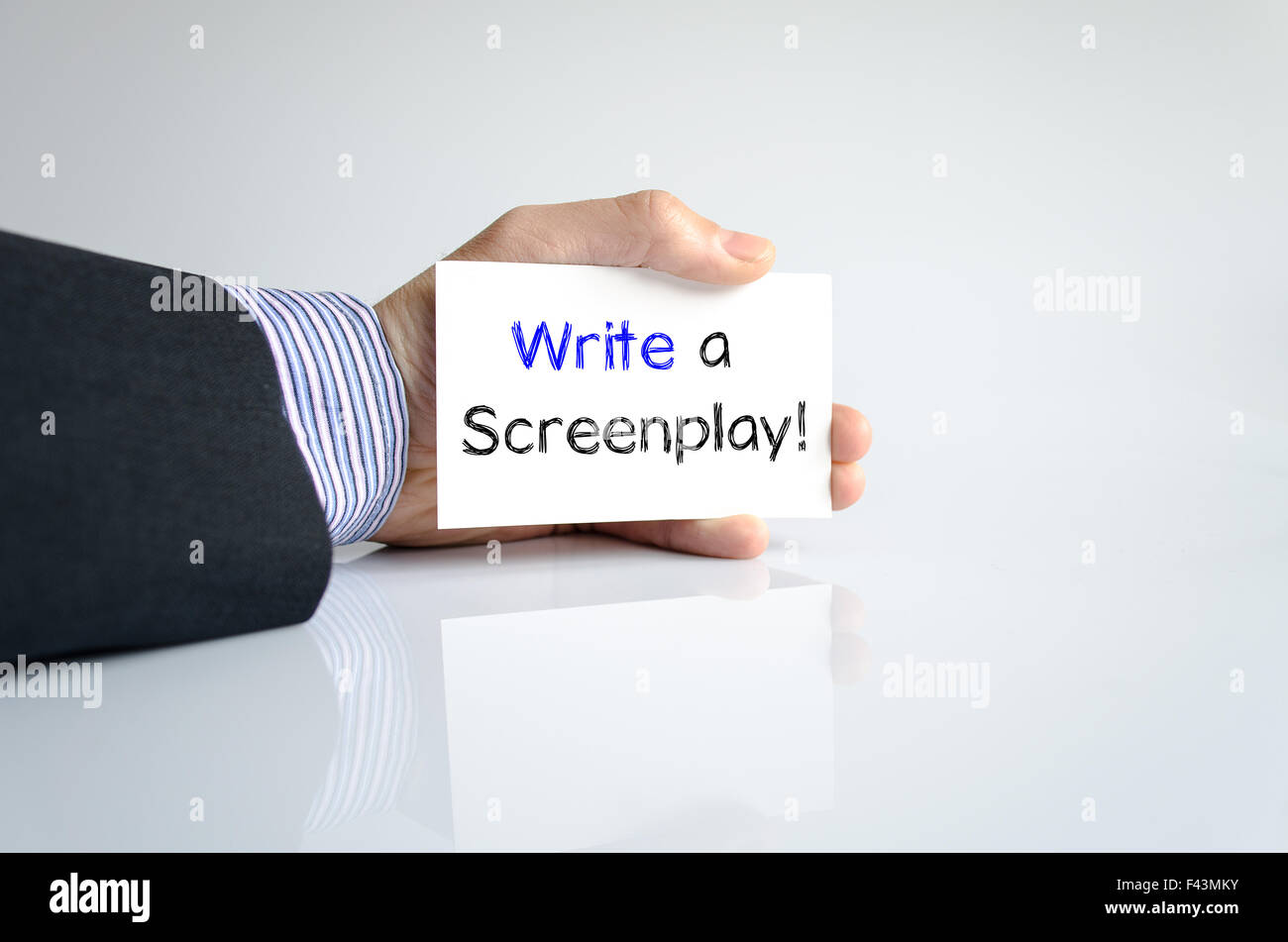 Bussines man hand writing write a screenplay Stock Photo - Alamy