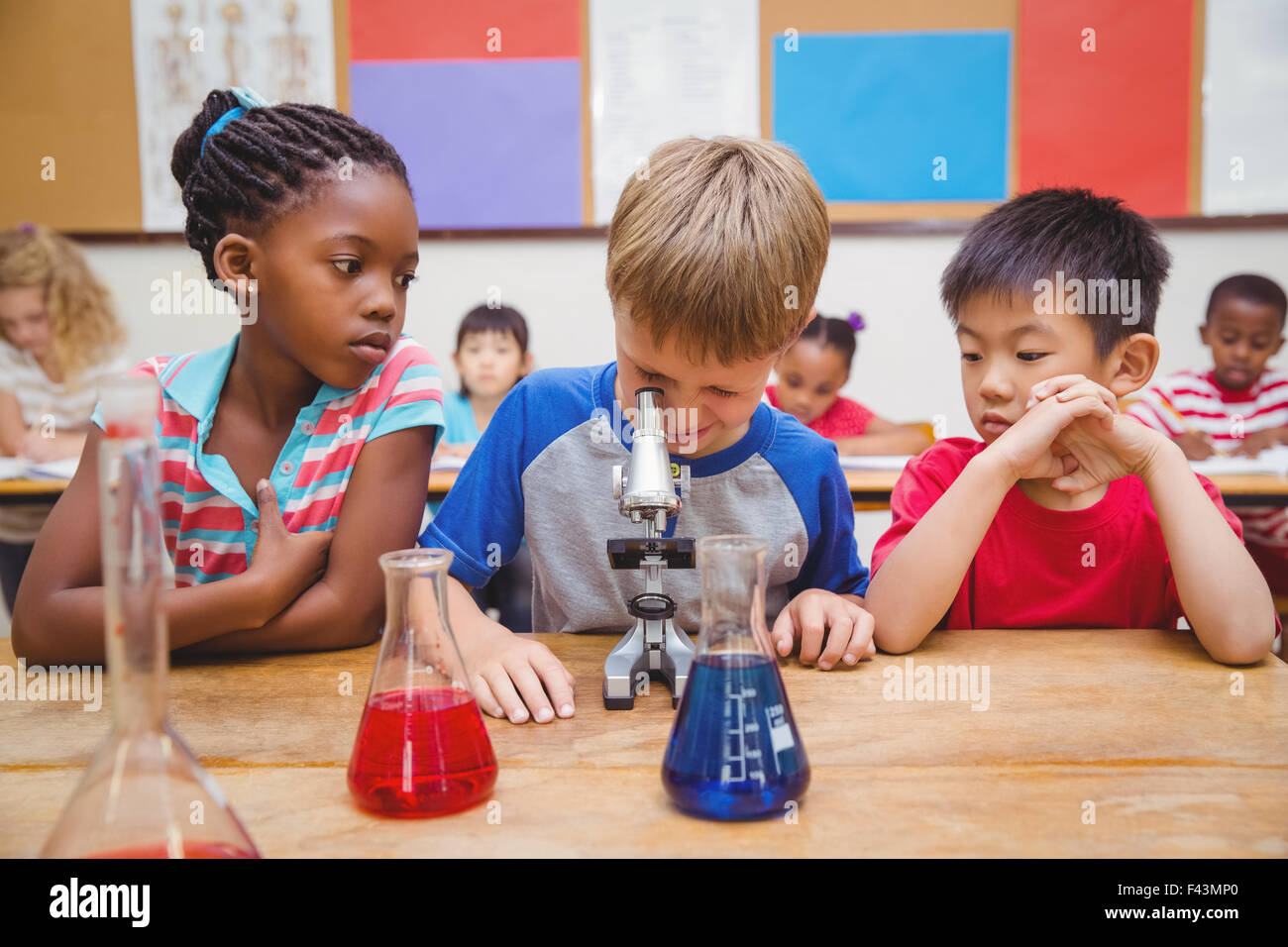Boy looking through microscope hi-res stock photography and images - Alamy