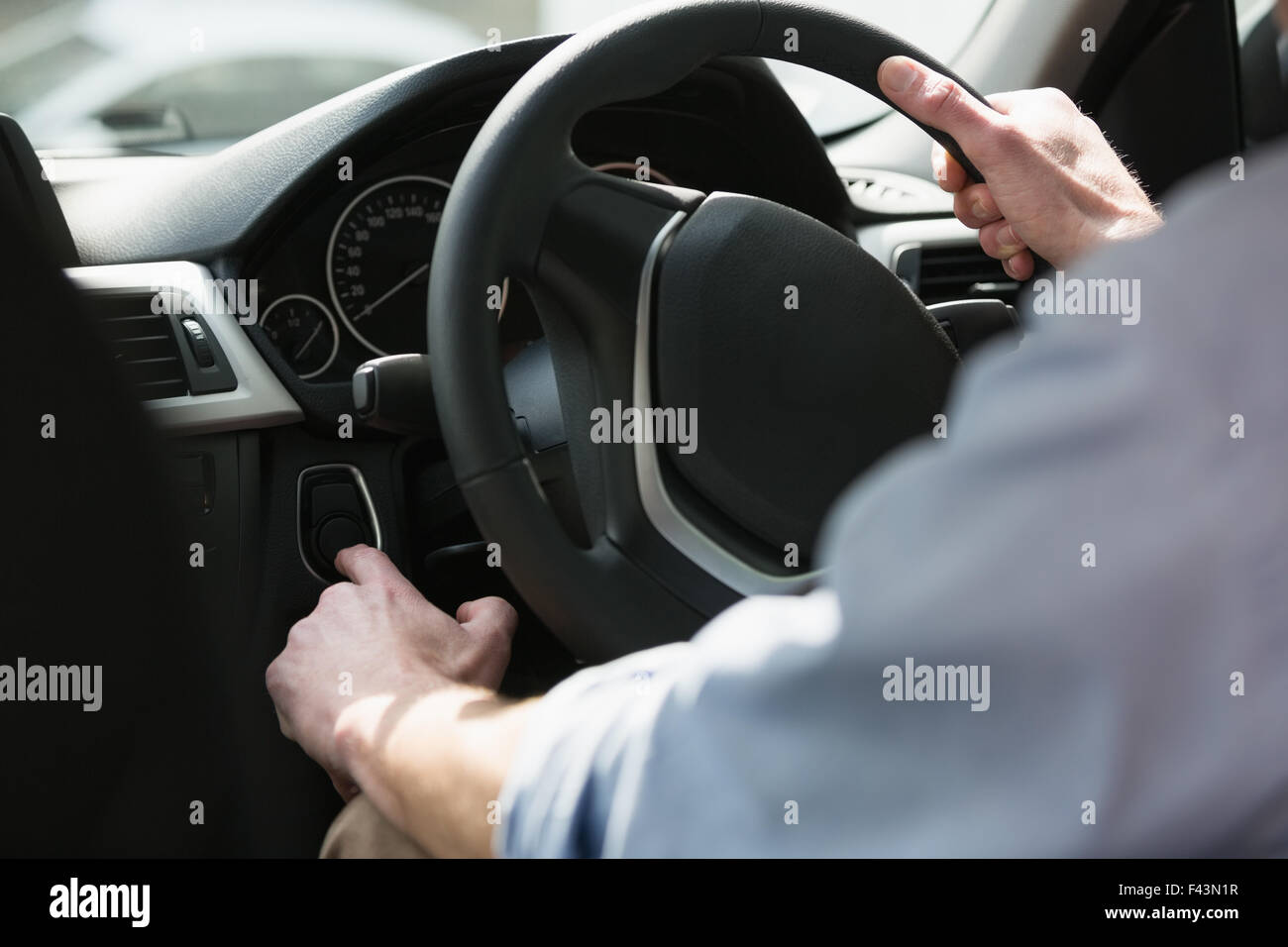 Handsome man driving holding steering hi-res stock photography and ...