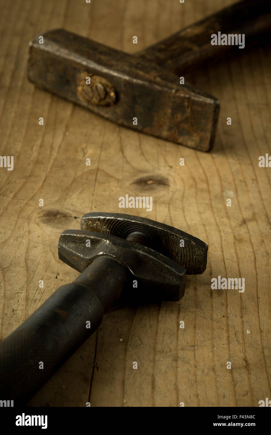 hammer and used adjustable wrench Stock Photo - Alamy