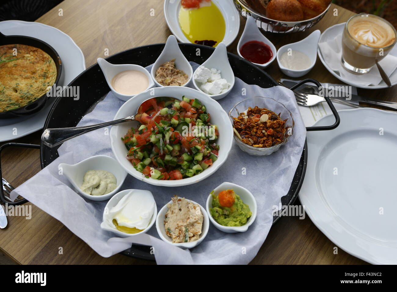 Traditional Israeli Breakfast with omelet, cheeses, salads, a fresh ...