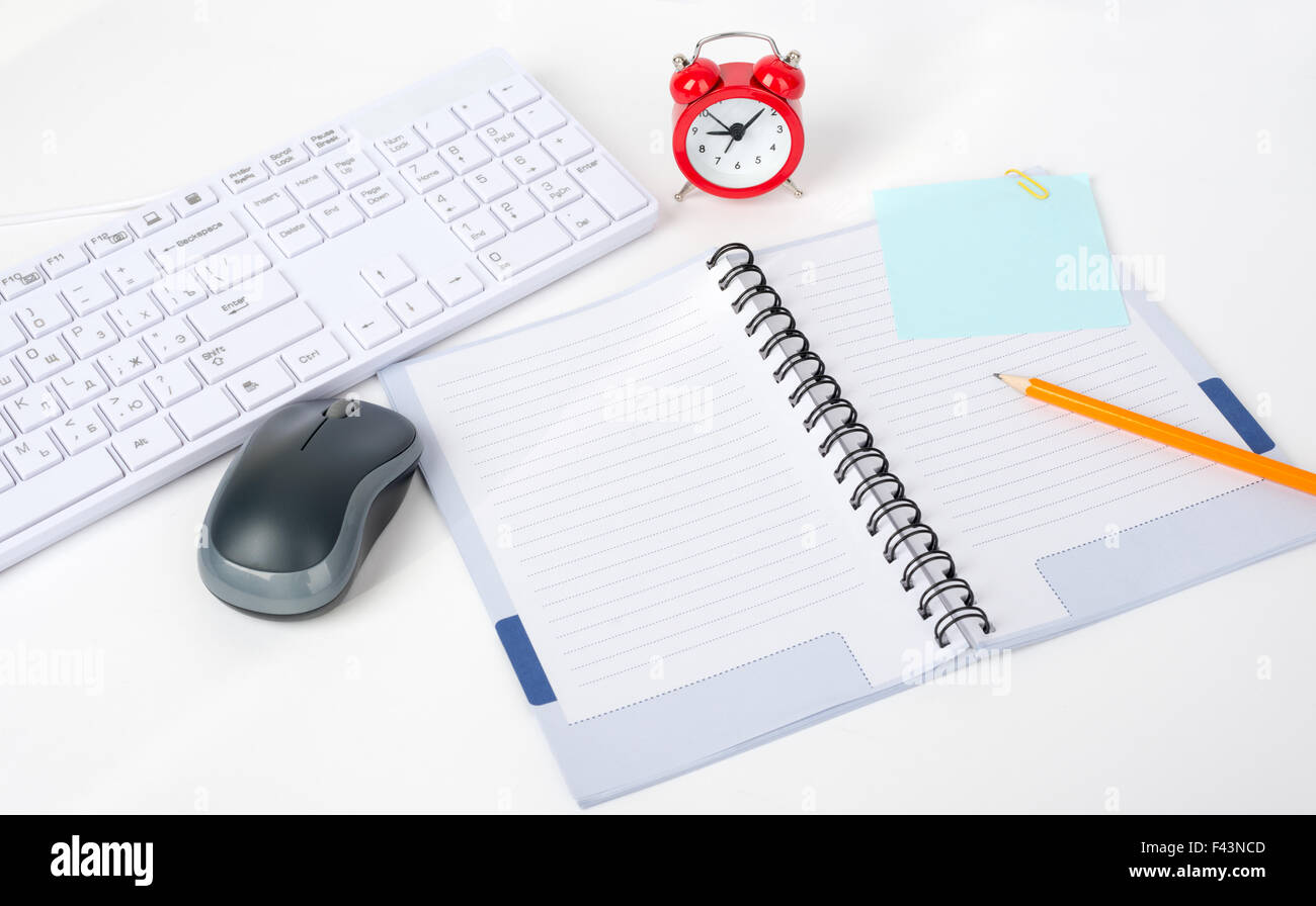 Keyboard with computer mouse and alarm clock Stock Photo - Alamy