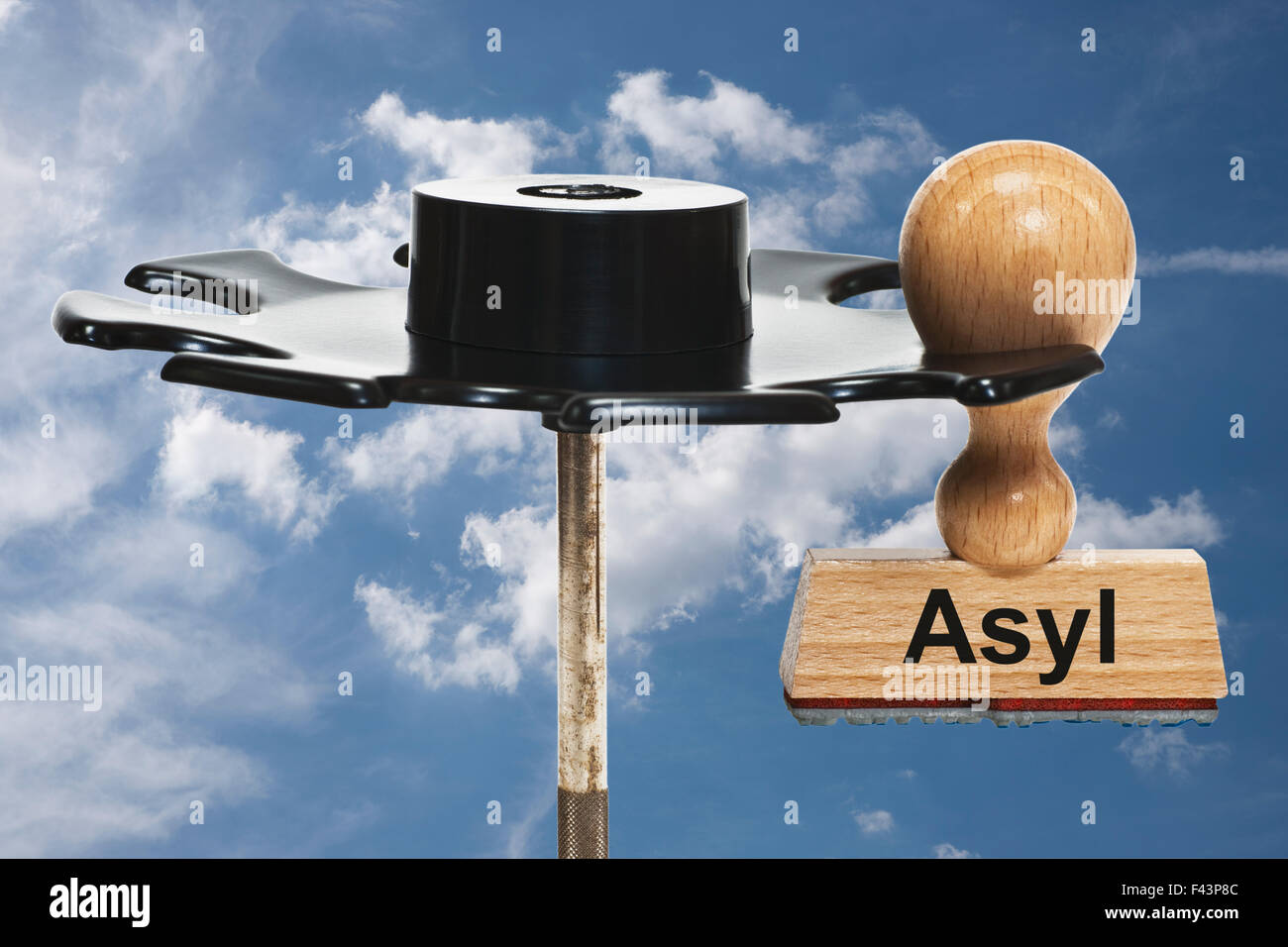 a stamp with the German inscription Asyl (Asylum) hangs in a stamp rack ...