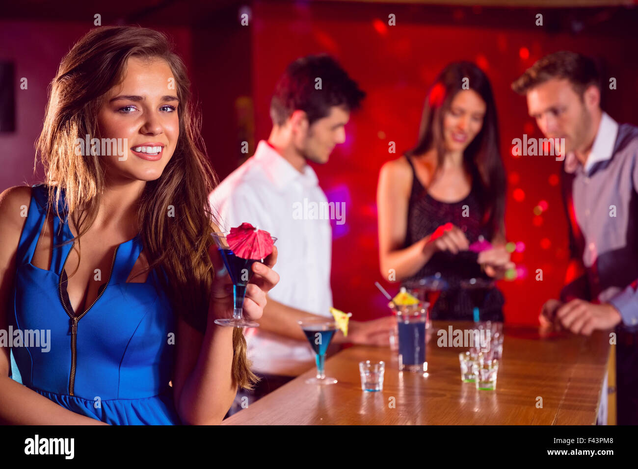 Happy friends on a night out together Stock Photo - Alamy