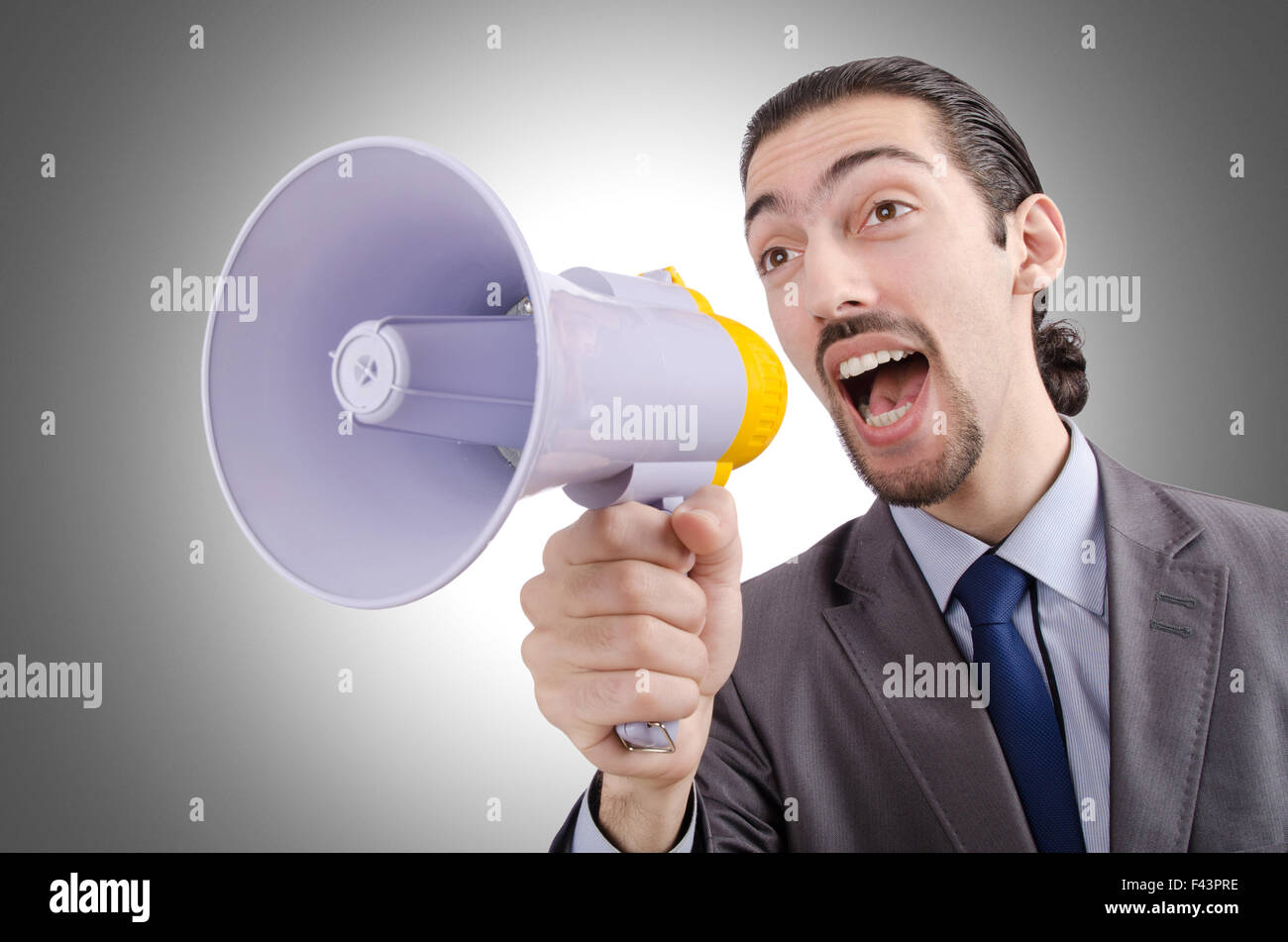 Man shouting and yelling with loudspeaker Stock Photo - Alamy
