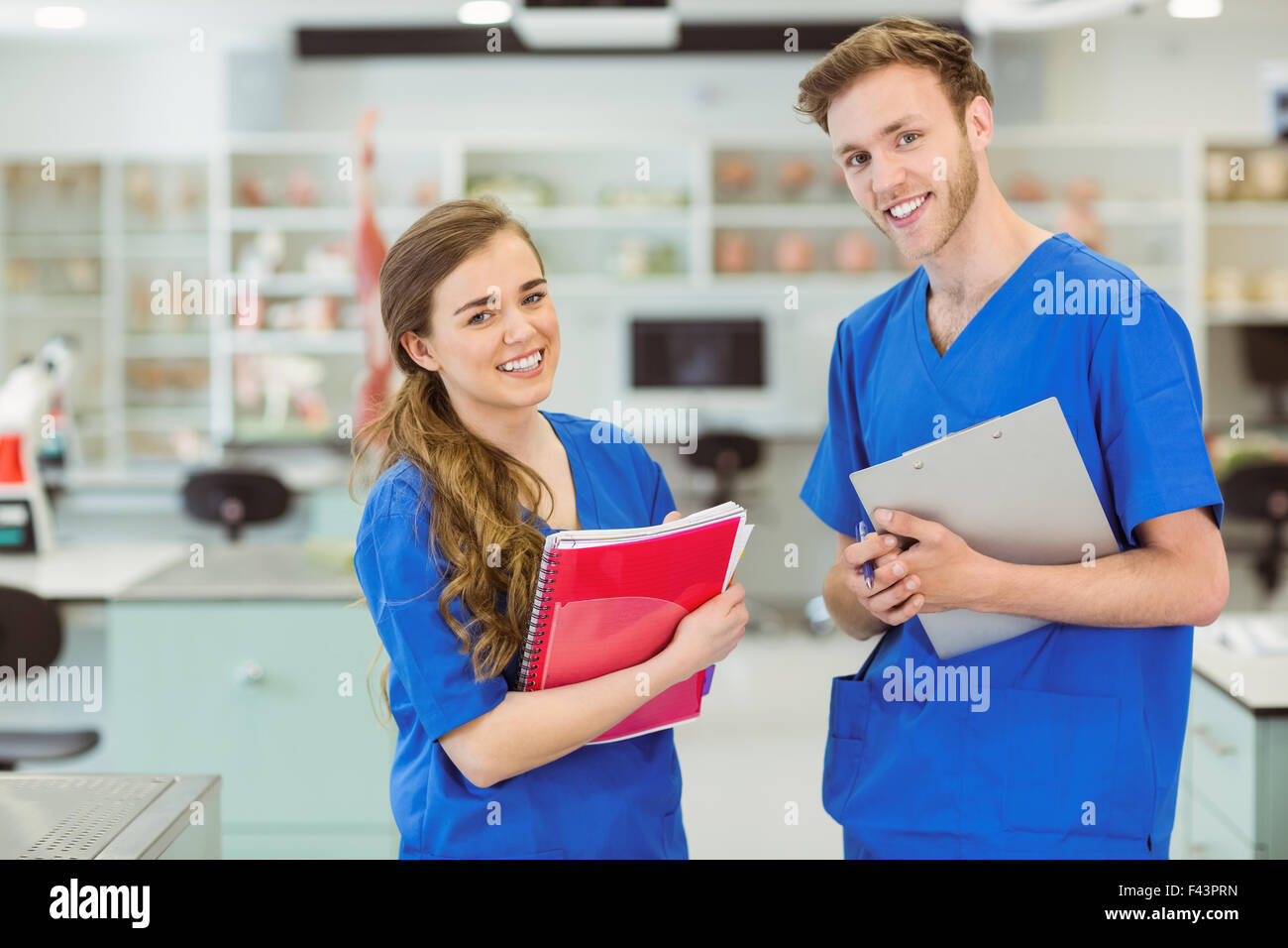 Young medical students smiling at camera Stock Photo - Alamy