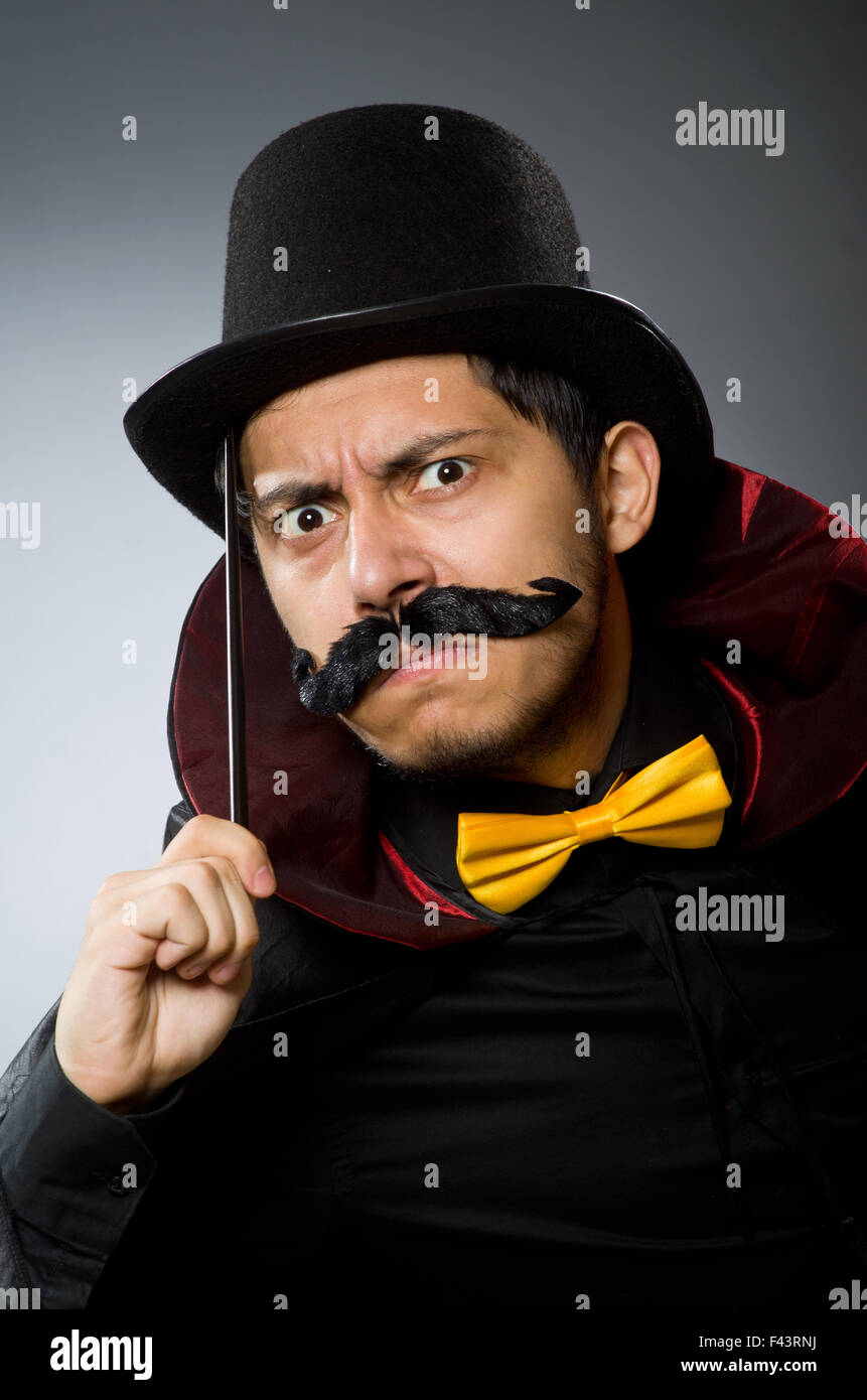 Funny magician man with wand and hat Stock Photo - Alamy