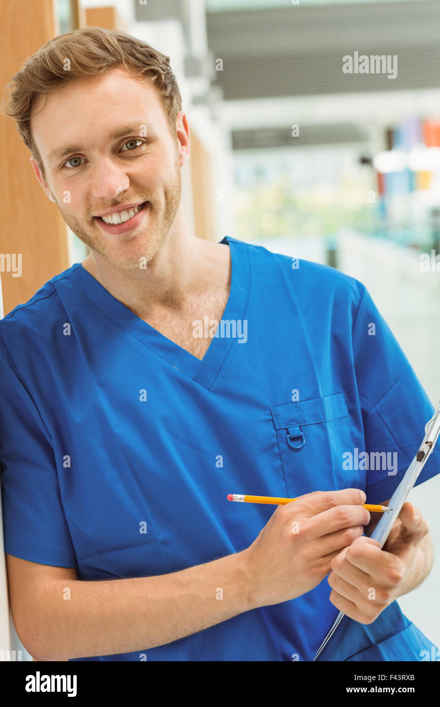 Medical student smiling at camera in hallway Stock Photo - Alamy
