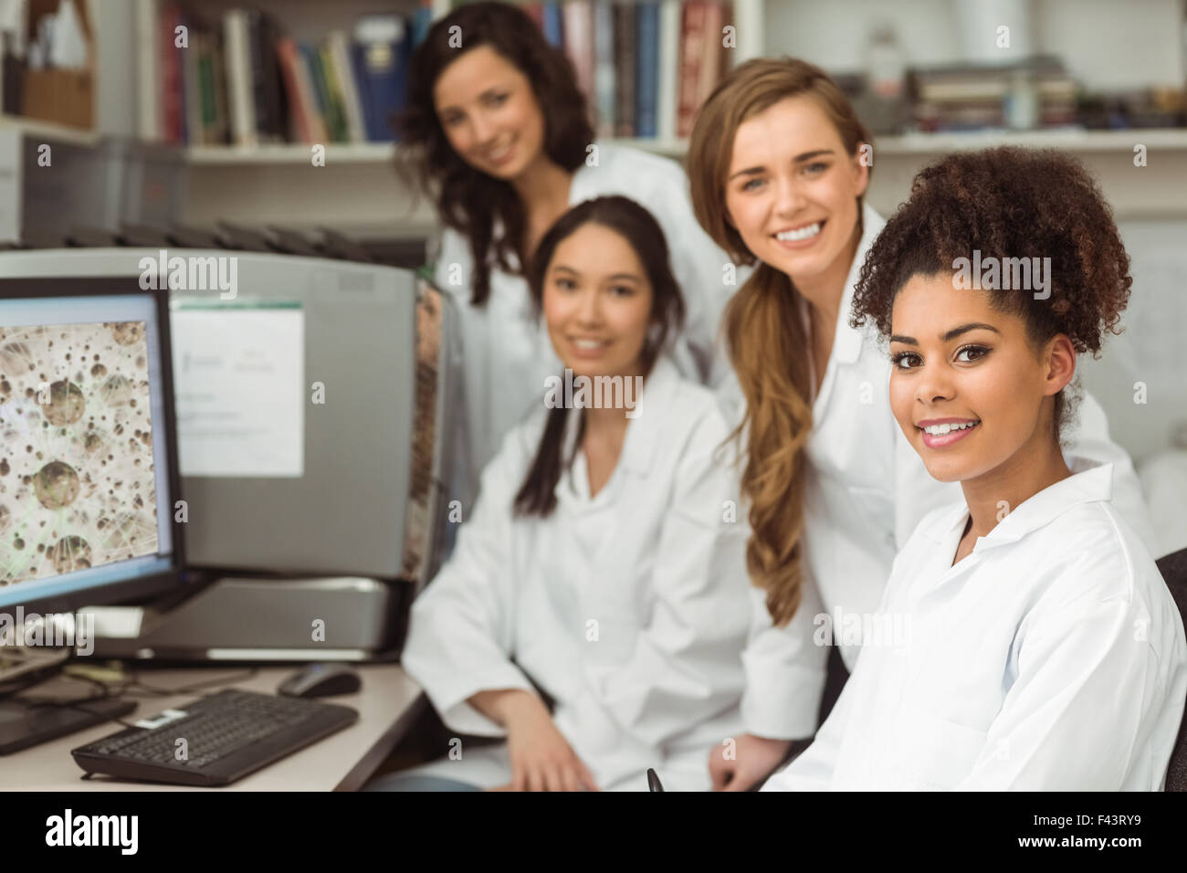 Science students smiling at camera Stock Photo - Alamy