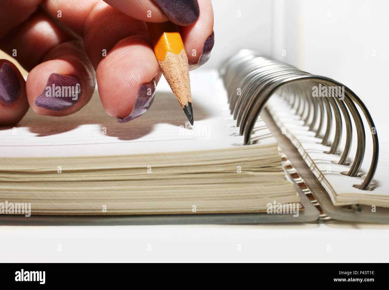 Woman pencil writing ring hi-res stock photography and images - Alamy