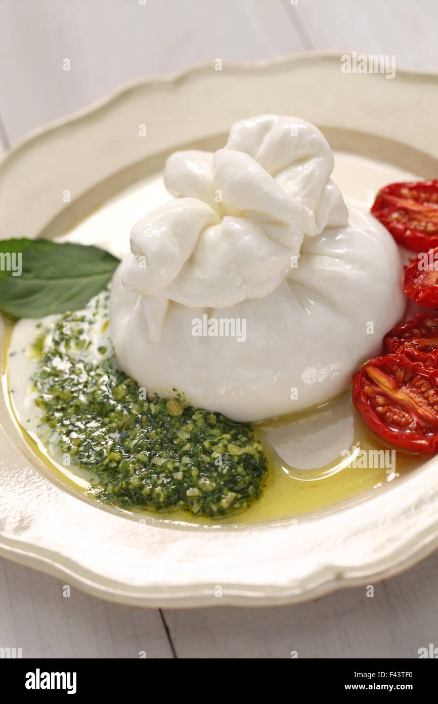 burrata, fresh italian cheese made from mozzarella and cream Stock ...
