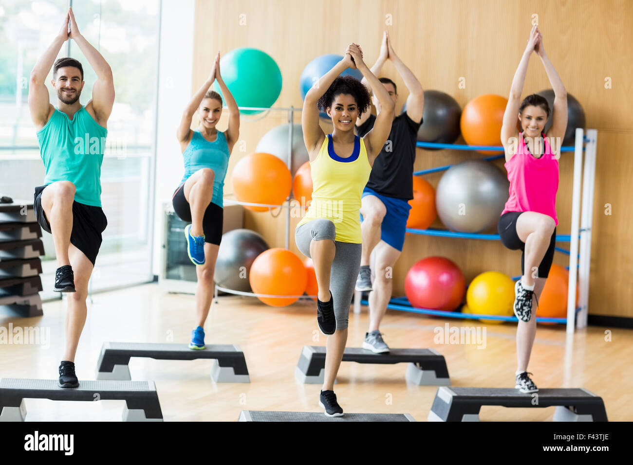 Fitness class exercising in the studio Stock Photo - Alamy