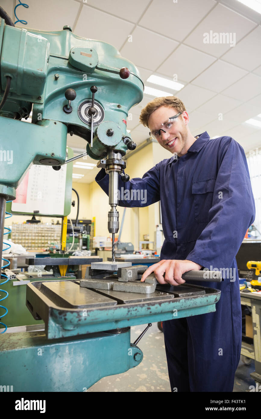 Engineering student using large drill Stock Photo - Alamy