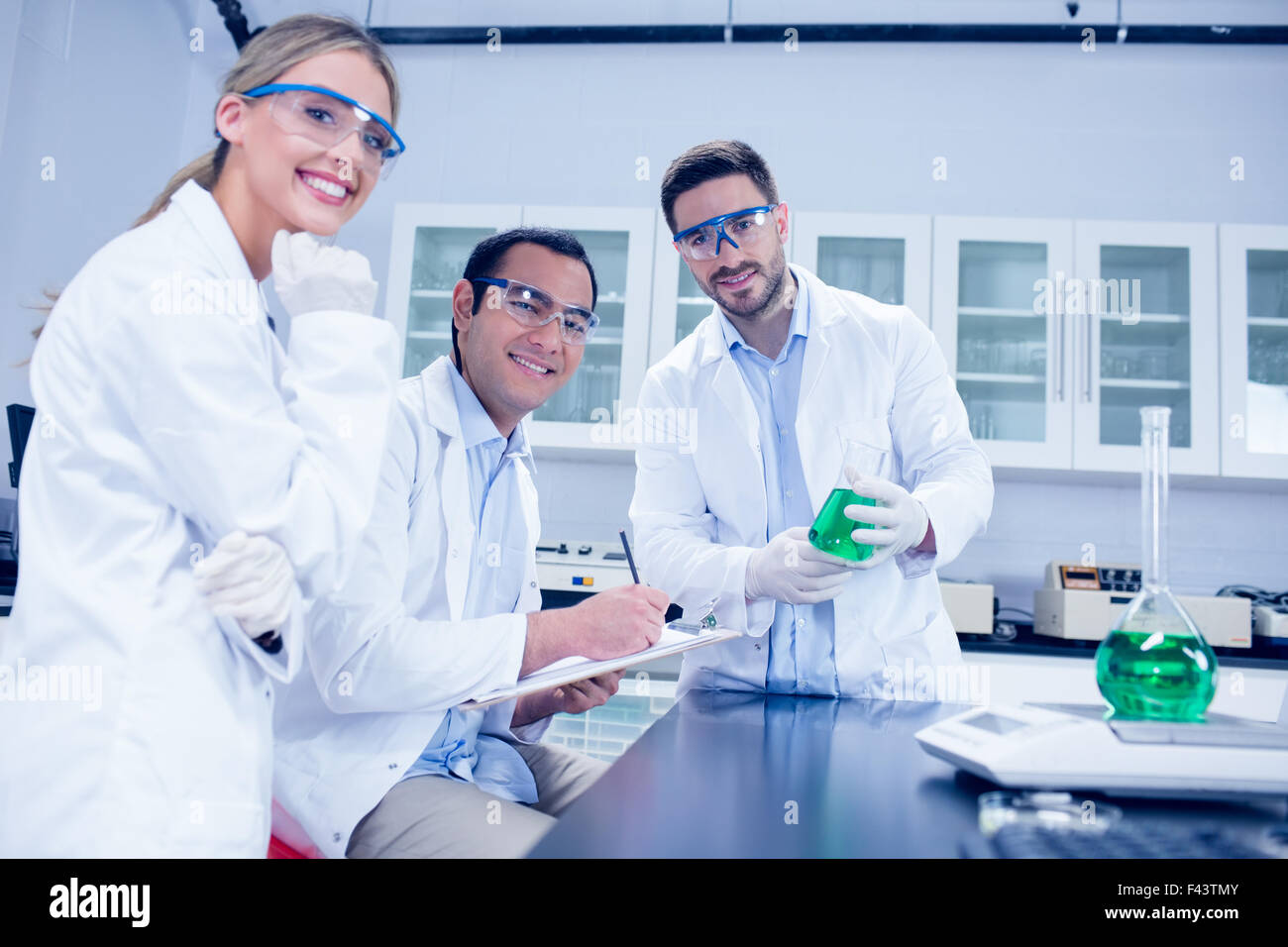 Science students working together in the lab Stock Photo - Alamy