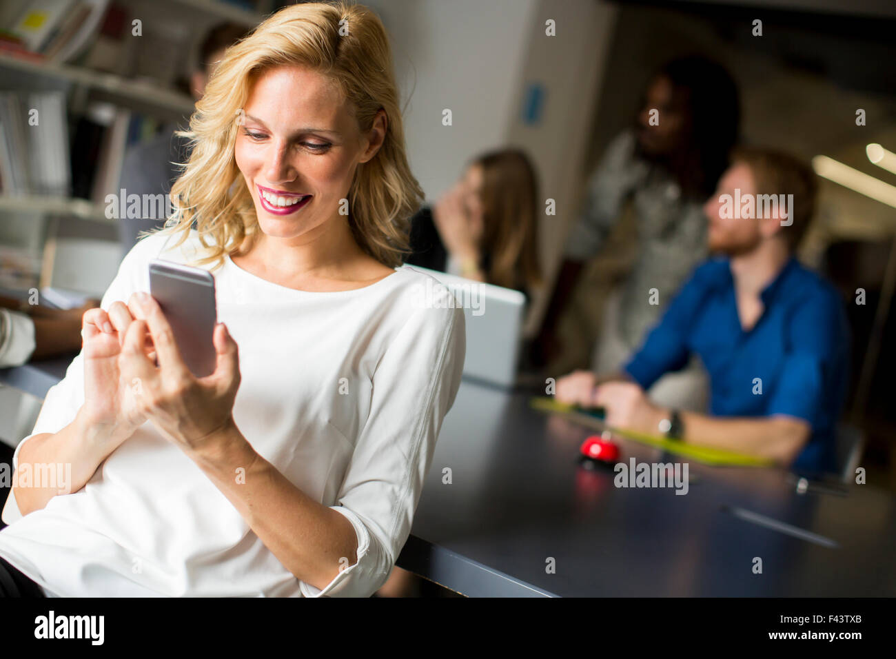 Young people in the office Stock Photo - Alamy