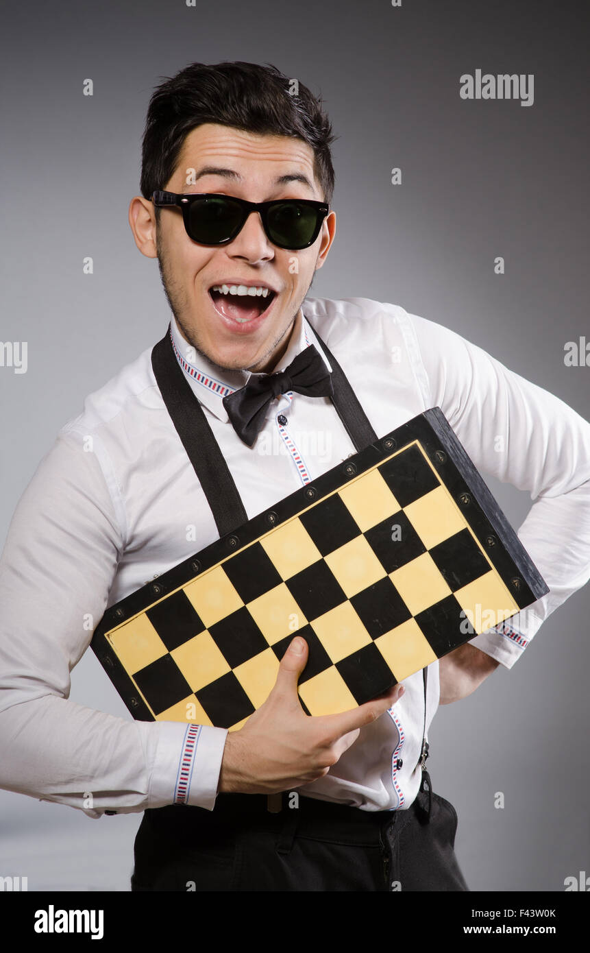 Funny chess player with board Stock Photo - Alamy