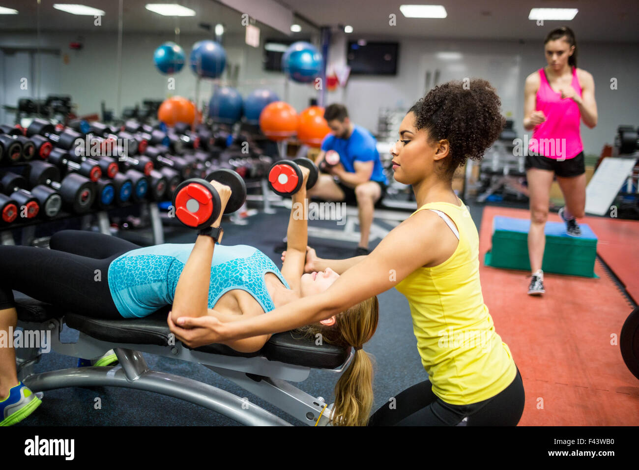 Fit people working out in weights room Stock Photo - Alamy