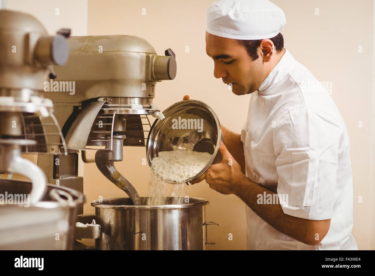 Smiling man pouring dough hi-res stock photography and images - Alamy