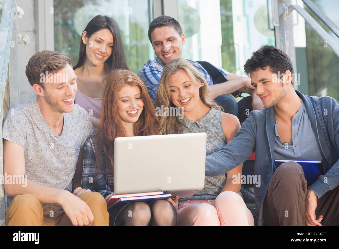 Students outside school looking laptop hi-res stock photography and ...
