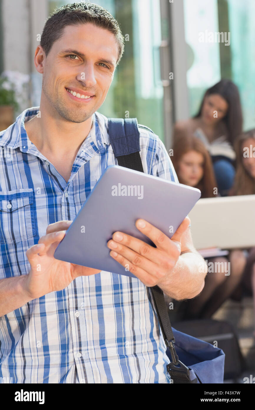 Happy student sitting on steps hi-res stock photography and images - Alamy